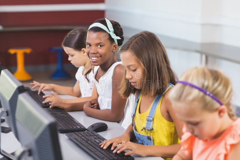 Schoolgirls Using Computer in Classroom Stock Image - Image of ...