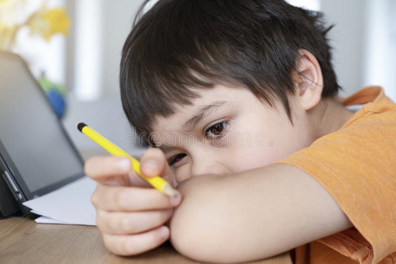 Schoolkid in Self Isolation Using Tablet for His Homework,Bored Child ...