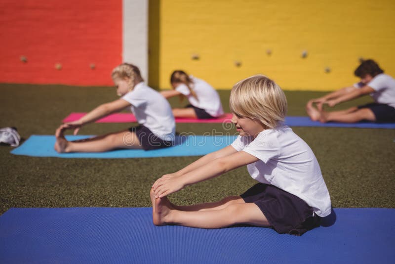 Coach Teaching Exercise To School Kids Stock Image - Image of girl ...