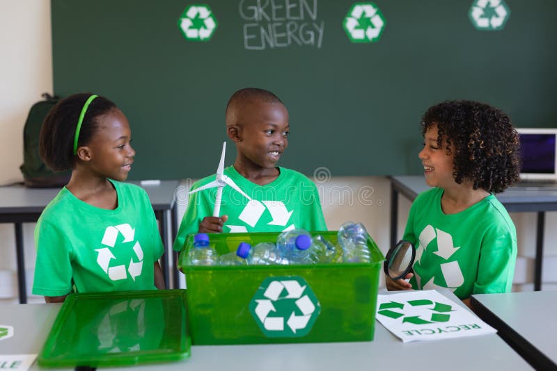 Schoolkids Studying about Green Energy and Recycle at Desk in Classroom ...