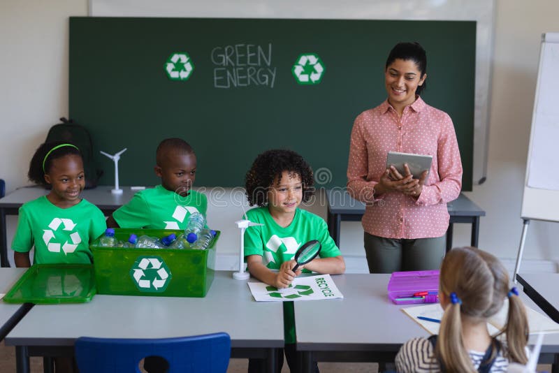 Schoolkids Studying about Green Energy and Recycle at Desk in Classroom ...