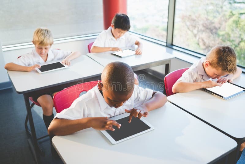 Schoolkids Using Digital Tablets in Classroom Stock Image - Image of ...