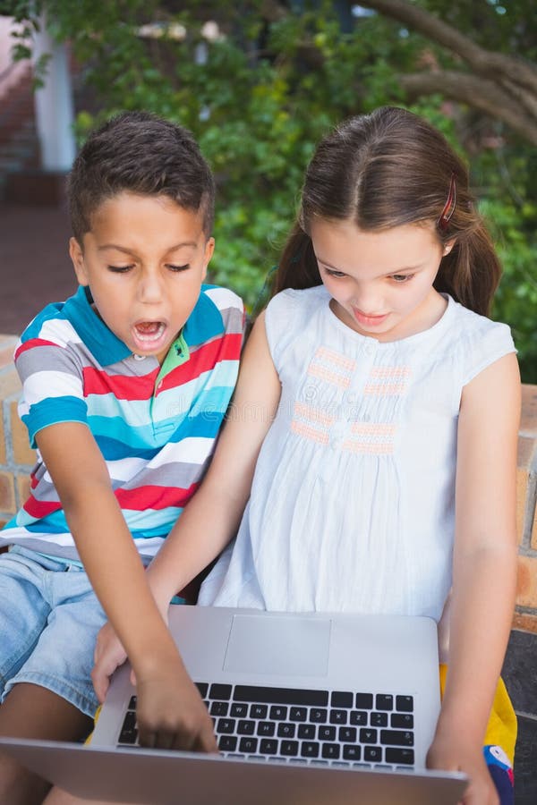 Schoolkids Using Laptop in School Campus Stock Photo - Image of ...