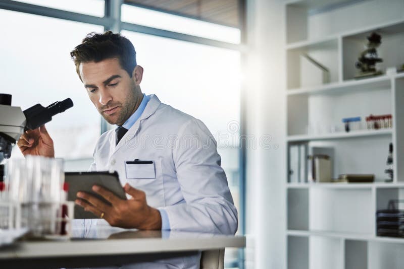 Science Advances As Technology Does. a Scientist Using a Digital Tablet ...