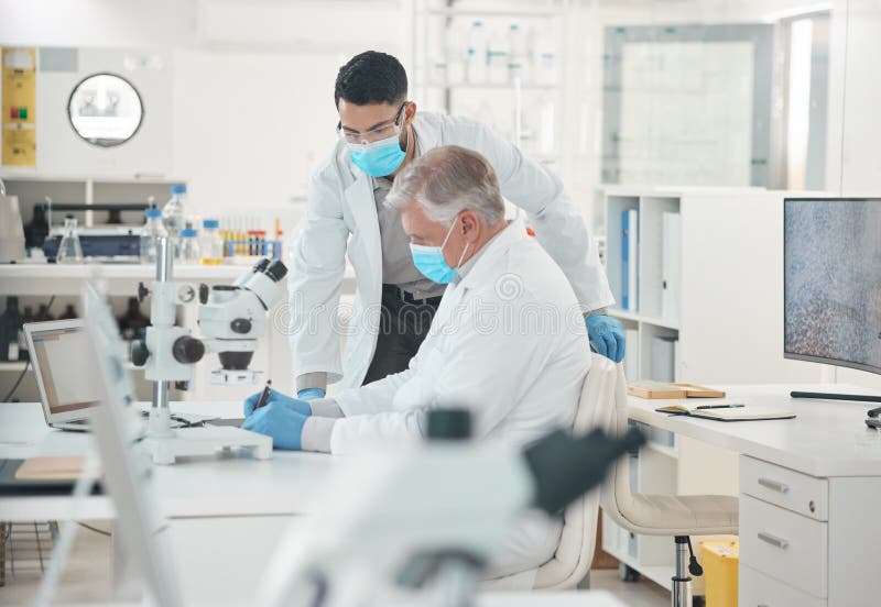 Science is All about Extensive Work. Two Scientists Working Together in ... Science is All about Extensive Work. Two Scientists Working Together in ...