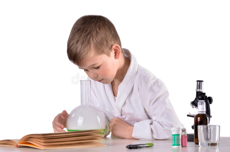 Science Boy Looks Inside Flask at the Desk Stock Image - Image of ...