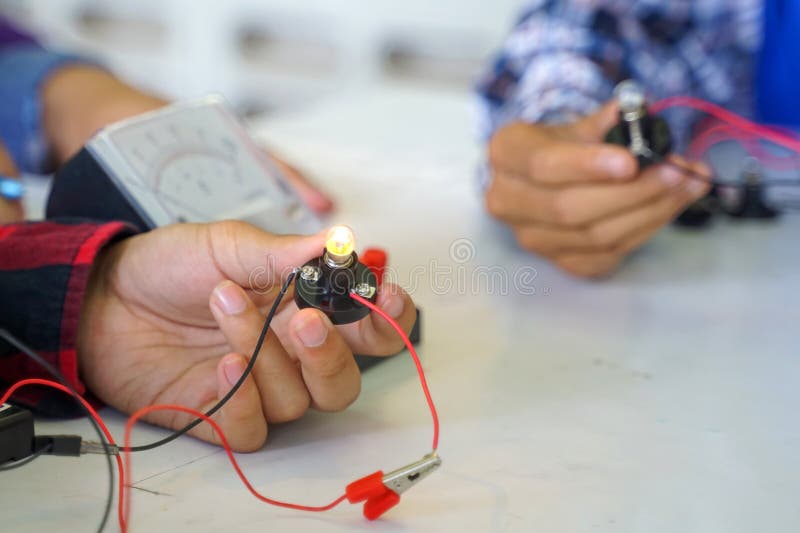 Science Classroom, Students are Conducting Experiments on Basic ...