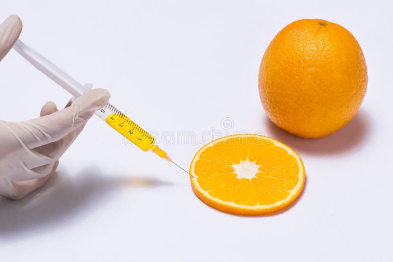 Science Experiment with Orange and Syringe Isolated on White. Stock ...