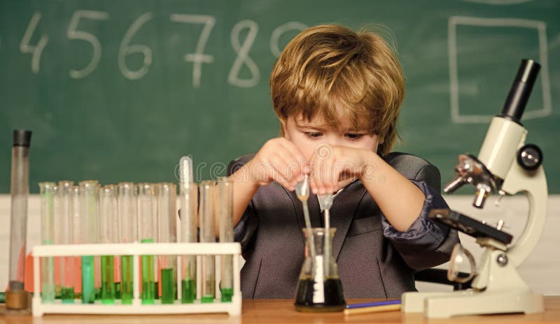 Science Experiments with Microscope at Lab. Kid Scientist Studying ...