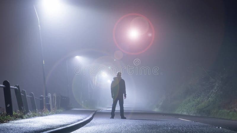 A Science Fiction Edit. of a Man Standing in the Road. with a Glowing ...