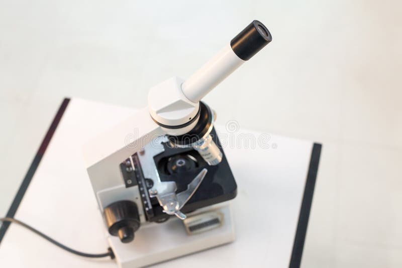 In a Science Lab with a Microscope Stock Photo - Image of hands ...