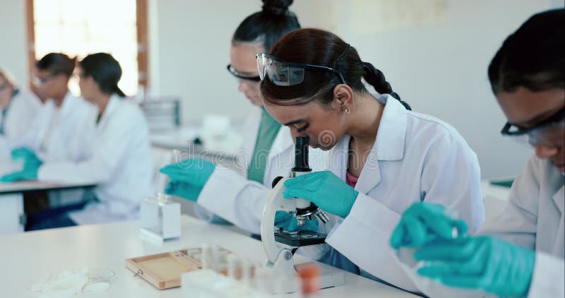 Science, Classroom and Students in Laboratory with Microscope for ...