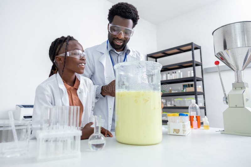 Teacher and Student Working in a School Laboratory and Looking Involved ...