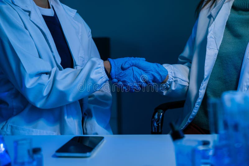Science and Medicine, Scientist Shaking Hands, Working Together As a ...