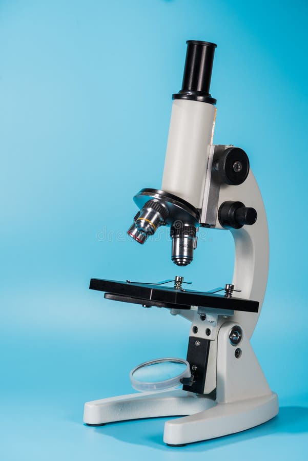 Science Microscope on Light Blue Background Stock Photo - Image of lens ...
