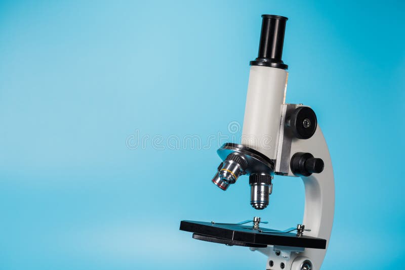 Science Microscope on Light Blue Background Stock Image - Image of ...