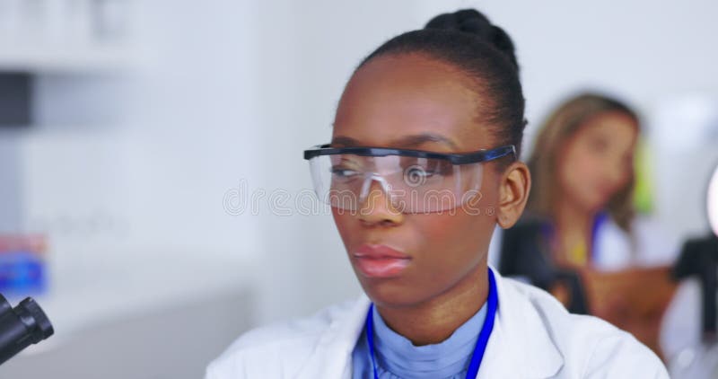 Science, Microscope and Research with a Doctor Woman at Work in a Lab ...