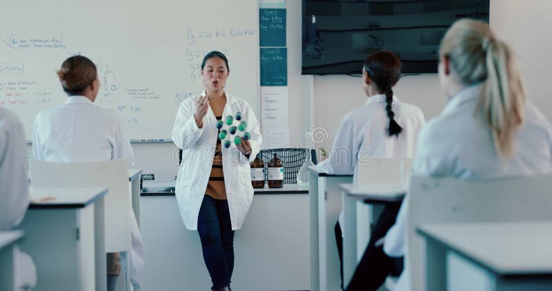 Science, Molecules and an Asian Woman Professor Teaching Class in a ...