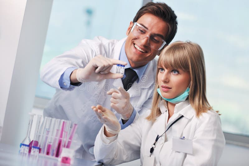 Science Test. Chemist Scientific Testing. Group Scientist Working at ...