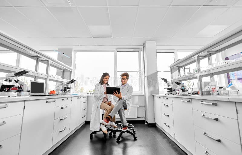Scientists with Tablet Pc Working in Laboratory Stock Photo - Image of ...
