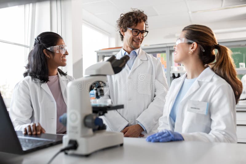 Scientists with Microscope Working in Laboratory Stock Image - Image of ...