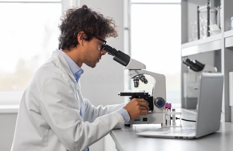 Scientist with Microscope Working in Laboratory Stock Image - Image of ...