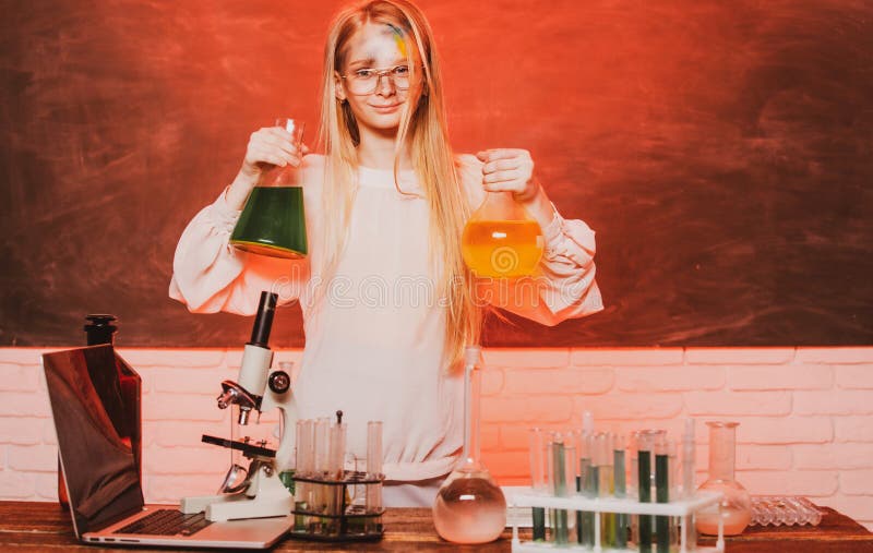 Science and School Education. Funny Girl Doing Experiments in the ...