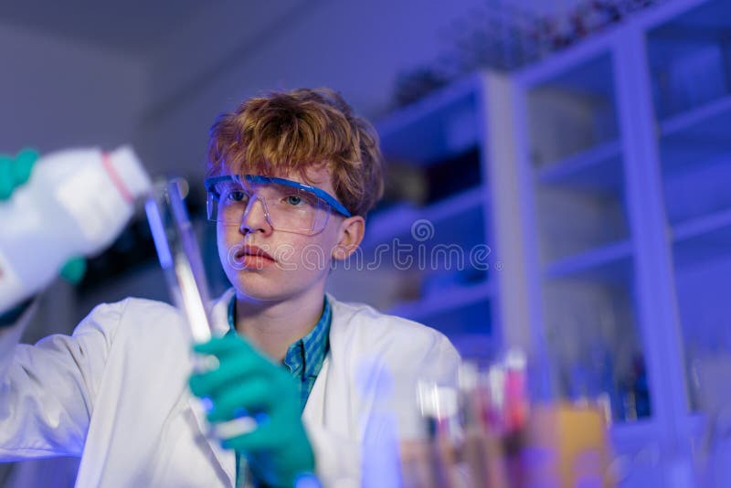 Science Student Doing Chemical Experiment in the Laboratory at ...