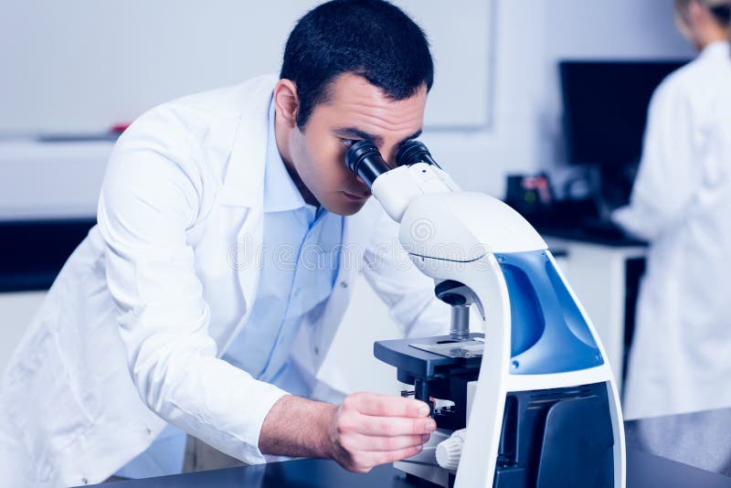 Science Student Looking through Microscope Stock Image - Image of ...