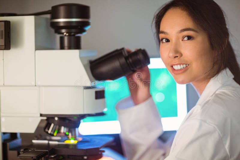 Science Student Looking through Microscope Stock Image - Image of side ...