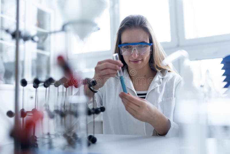Science Students Doing Chemical Experiment in the Laboratory at ...