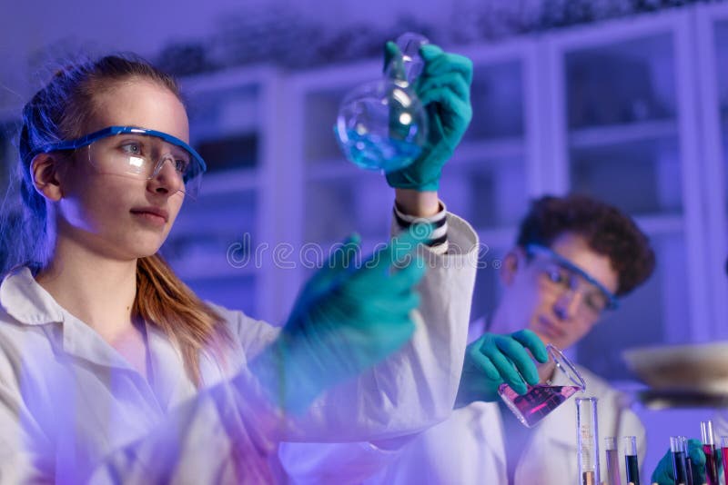 Science Students Doing Chemical Experiment in the Laboratory at ...