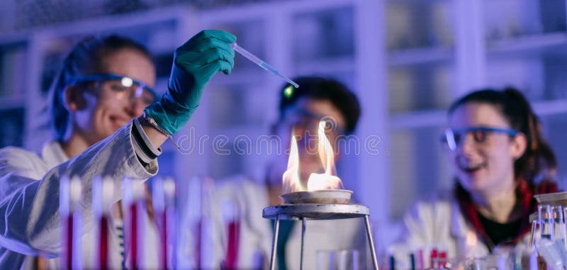 Science Students Doing Chemical Experiment in the Laboratory at ...