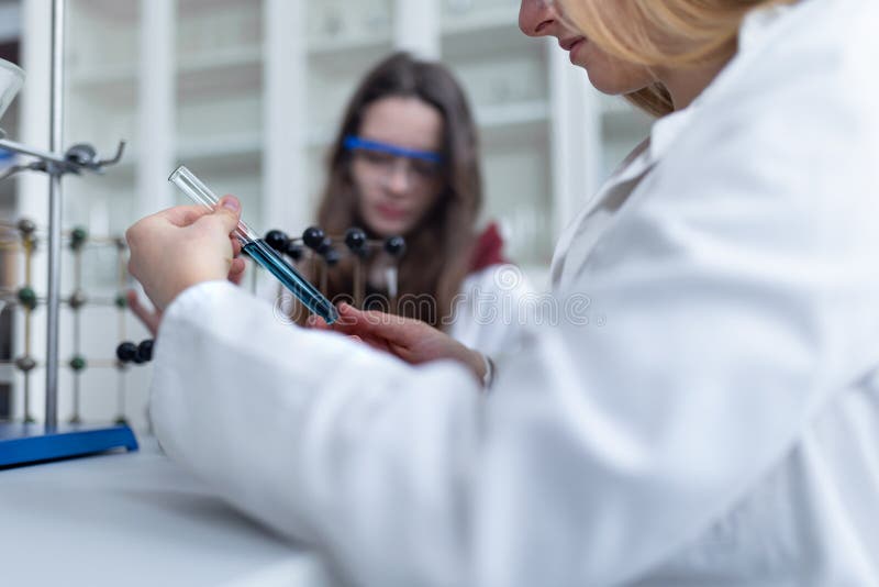 Science Students Doing Chemical Experiment in the Laboratory at ...