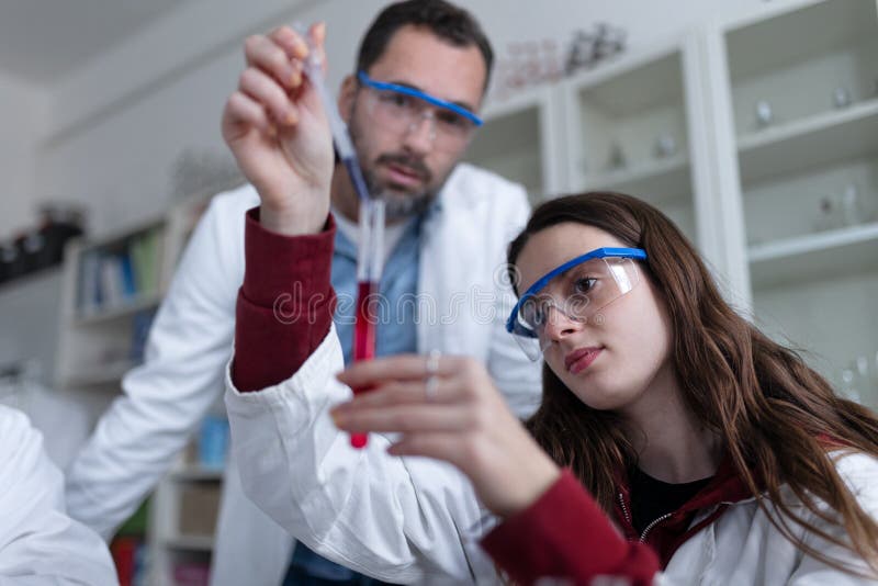 Science Students with Teacher Doing Chemical Experiment in the ...
