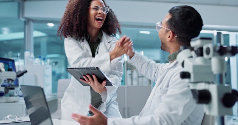 Science, Teamwork and High Five with Laptop in Laboratory for Test ...