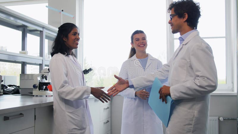 Scientists Shaking Hands in Laboratory Stock Video - Video of deal ...