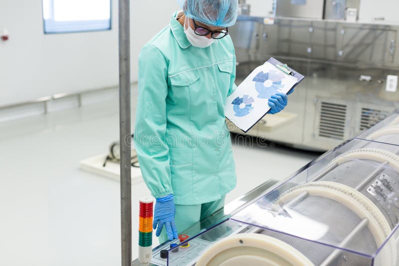 Science Worker Compares Readings of Equipment Stock Photo - Image of ...