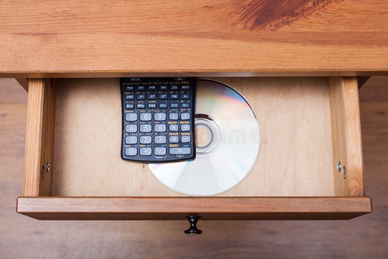 Scientific Calculator and Disk in Open Drawer Stock Photo - Image of ...