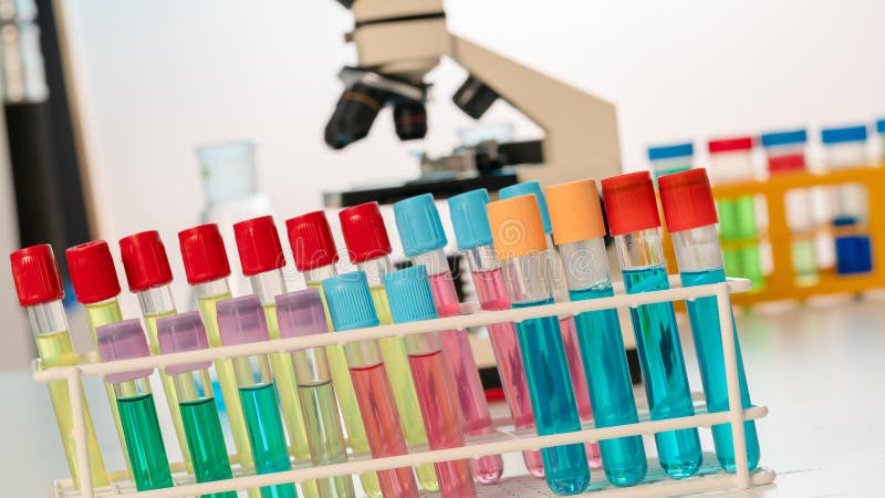 Scientific Experiment in School Class. Microscope and Test Tubes on the ...