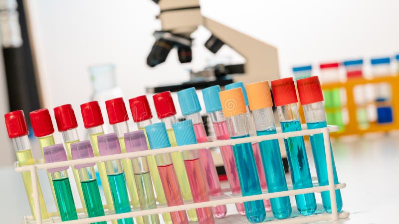 Scientific Experiment in School Class. Microscope and Test Tubes on the ...