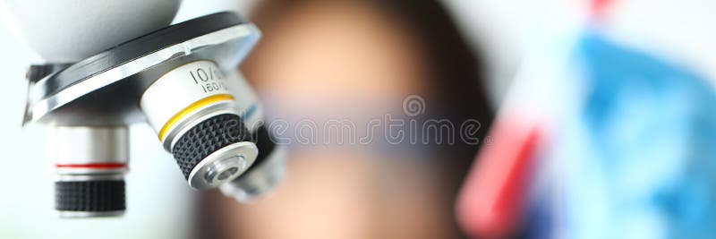 Scientific Microscope Lens with Female Analyst in Background Stock ...