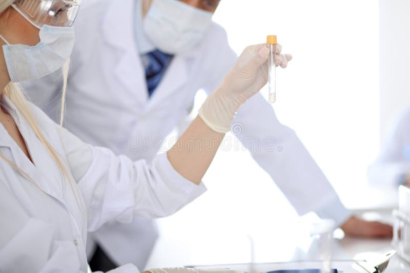 Scientific Research Team with Clear Solution in Laboratory Stock Image ...