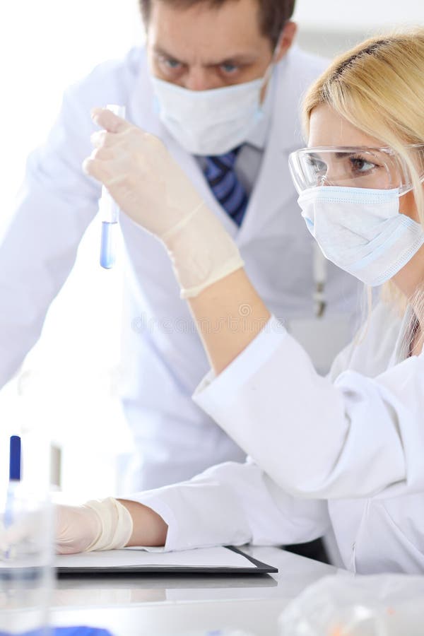 Scientific Research Team with Clear Solution in Laboratory Stock Image ...