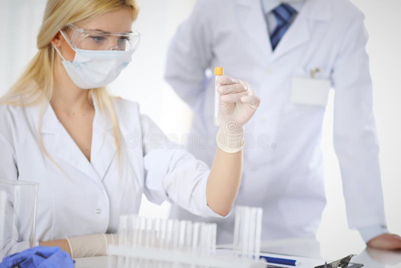 Scientific Research Team with Clear Solution in Laboratory Stock Image ...