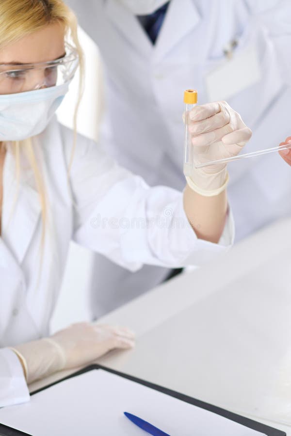 Scientific Research Team with Clear Solution in Laboratory Stock Photo ...