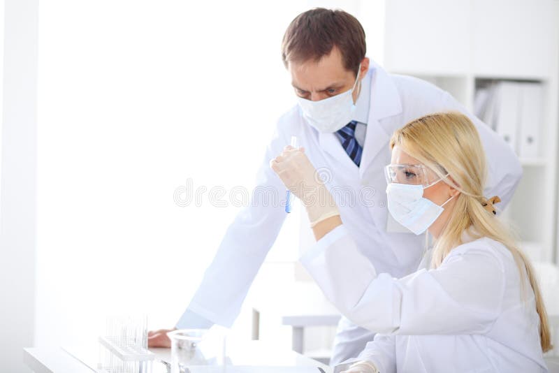 Scientific Research Team with Clear Solution in Laboratory Stock Photo ...