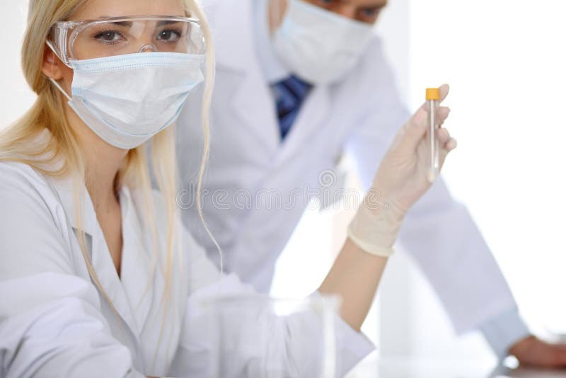 Scientific Research Team with Clear Solution in Laboratory Stock Image ...