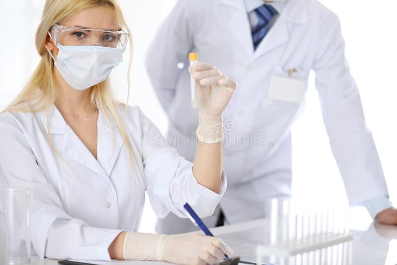 Scientific Research Team with Clear Solution in Laboratory Stock Photo ...