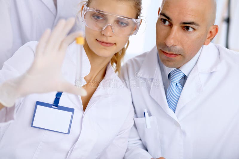 Scientific Research Team with Clear Solution in Laboratory Stock Image ...